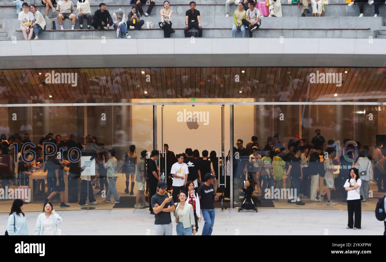 Customers shop at the largest Apple flagship store in Asia in Shanghai ...