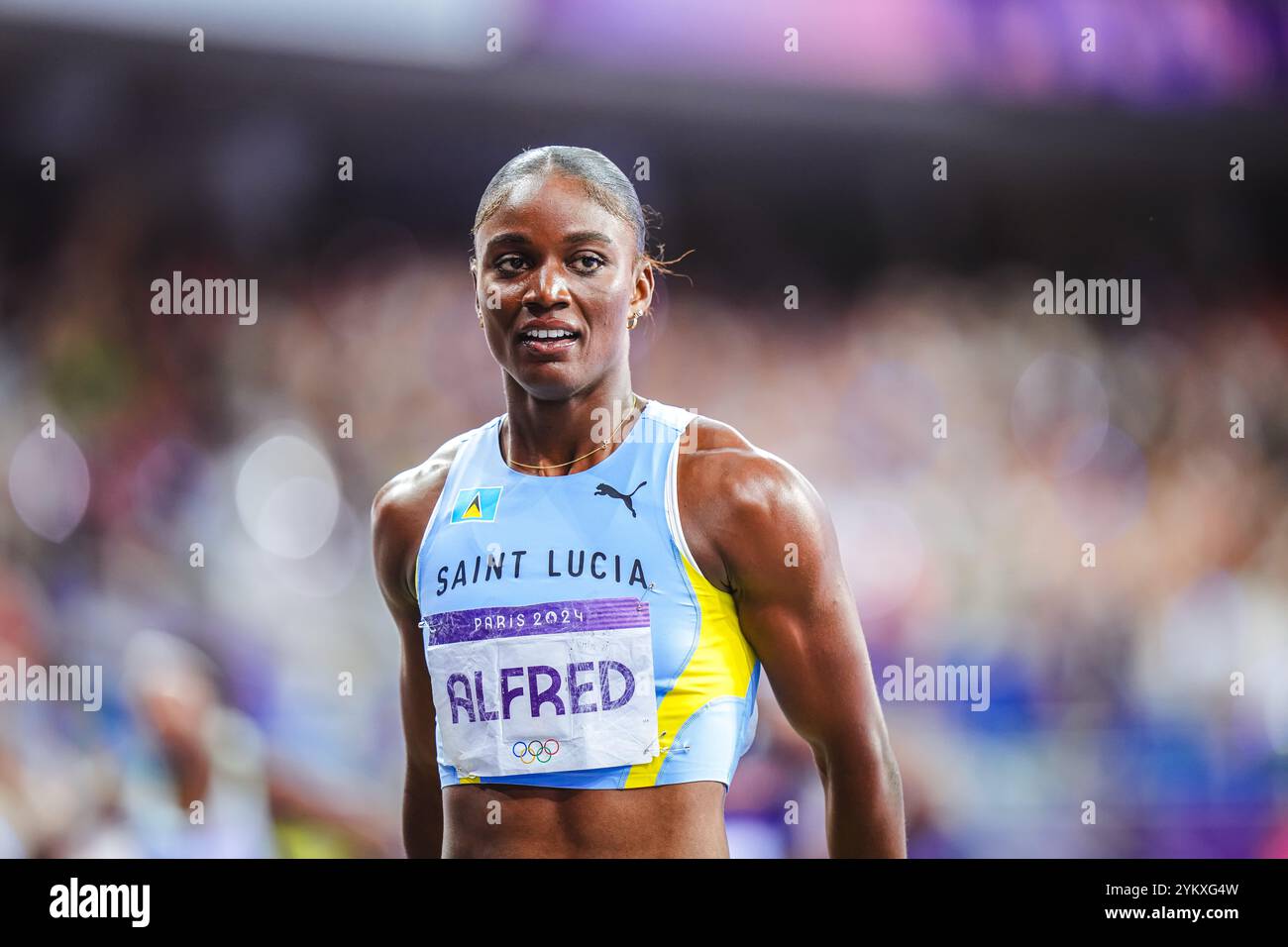Julien Alfred participating in the 200 meters at the Paris 2024 Olympic ...