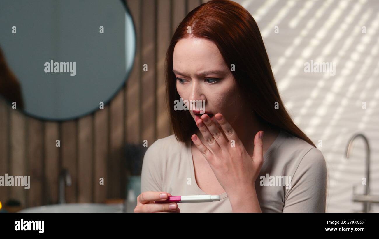 Pregnant Caucasian woman future mother female in home bathroom stressed ...