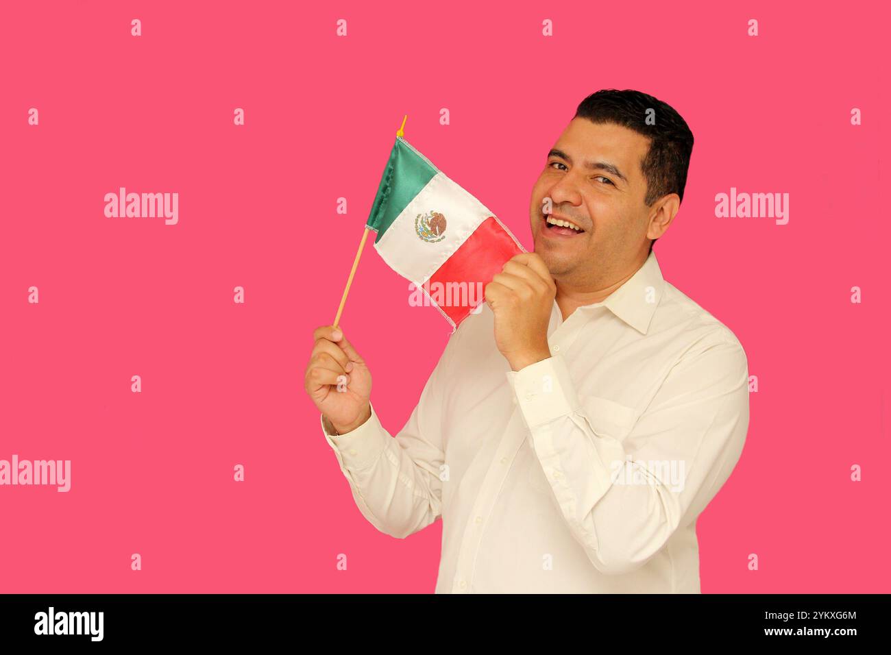 40 year old dark Mexican man shows the flag of Mexico with pride to ...
