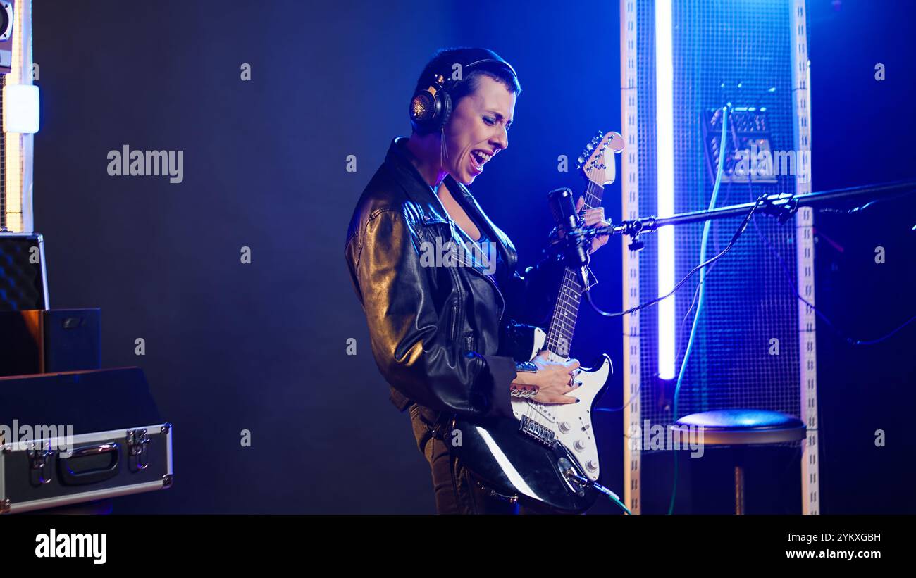 Female vocalist performing live alternative heavy metal music in a ...