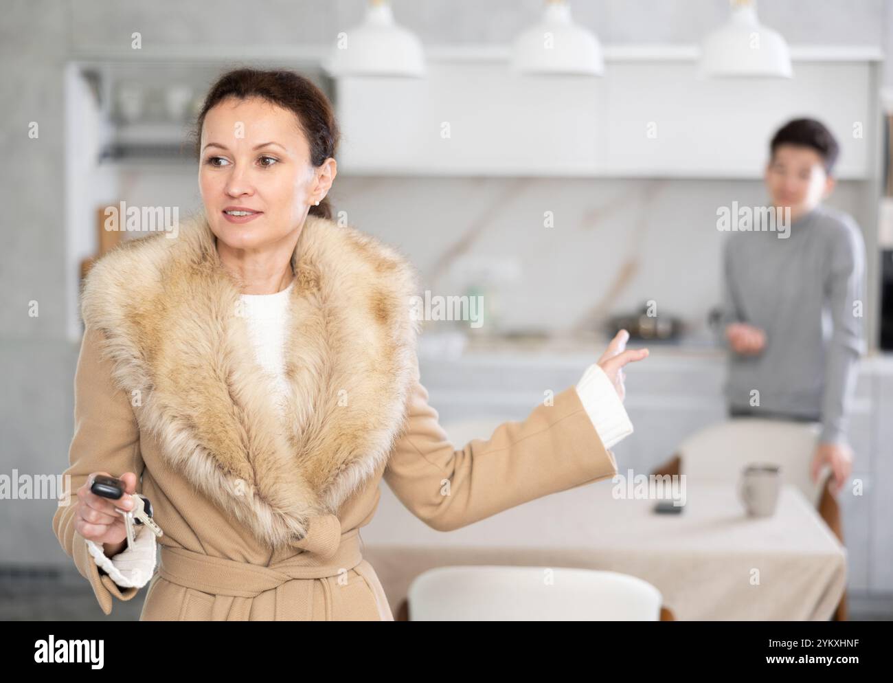 Mother leaving son home alone Stock Photo - Alamy