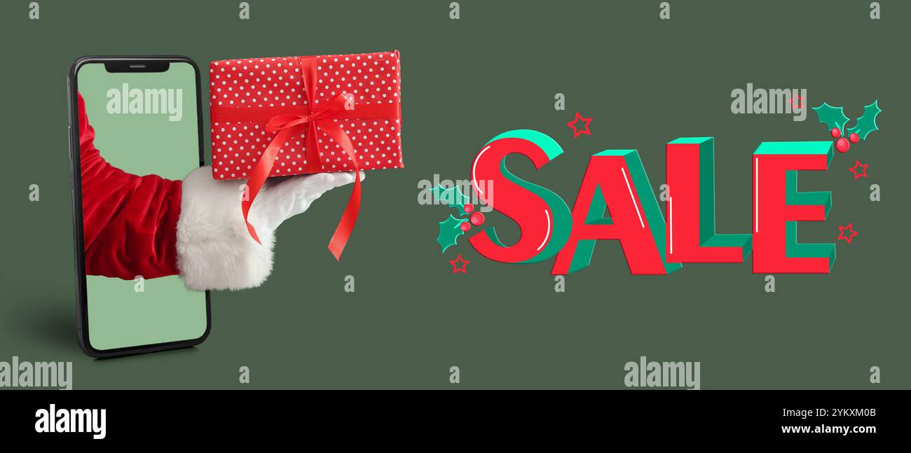Santa's hand with gift box coming out of phone screen on green ...