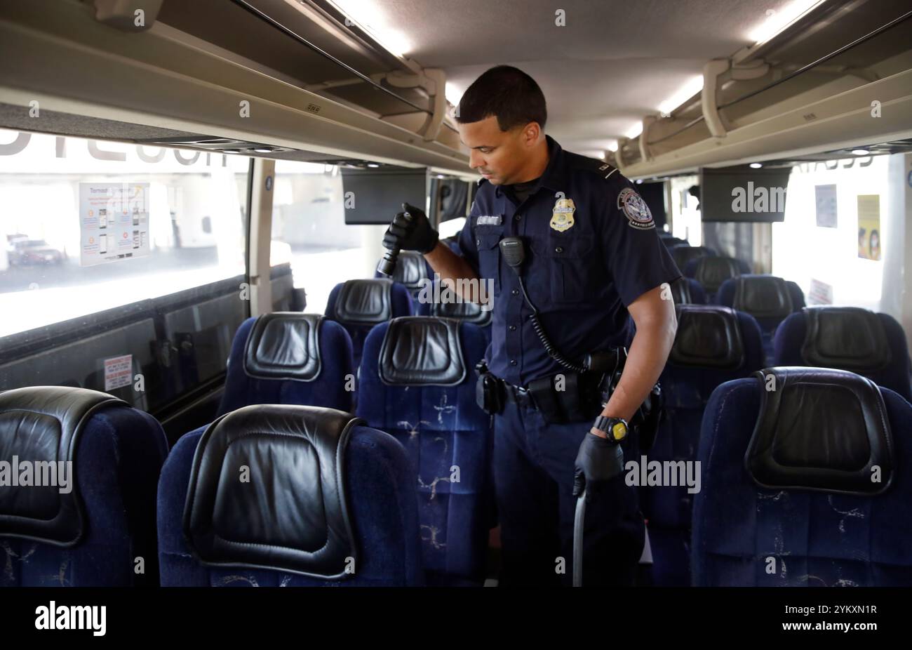 U.S. Customs and Border Protection officers screen border crossers as ...