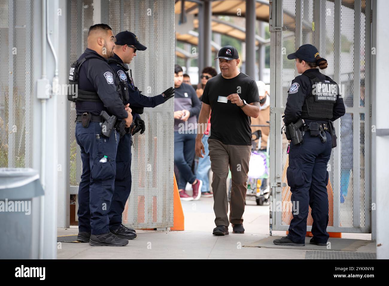 U.S. Customs and Border Protection officers screen border crossers as ...
