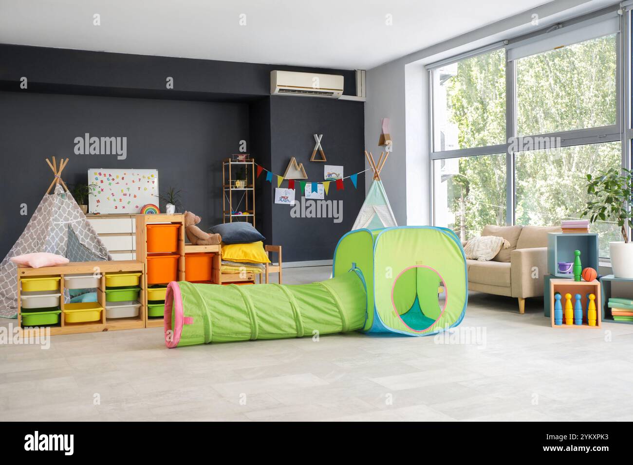 Interior of kindergarten with play tunnel and tents Stock Photo - Alamy