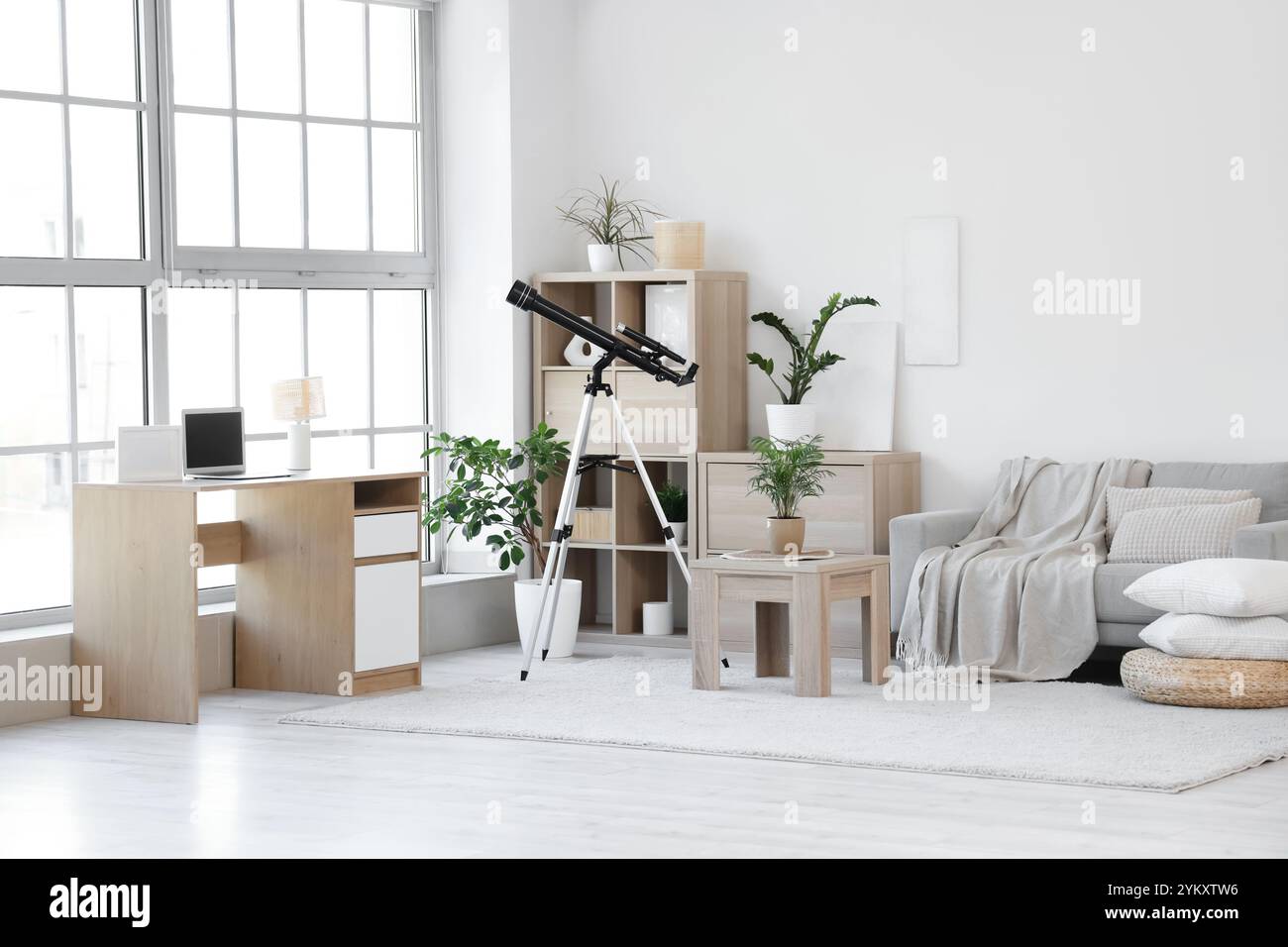 Interior of living room with modern telescope near window Stock Photo ...