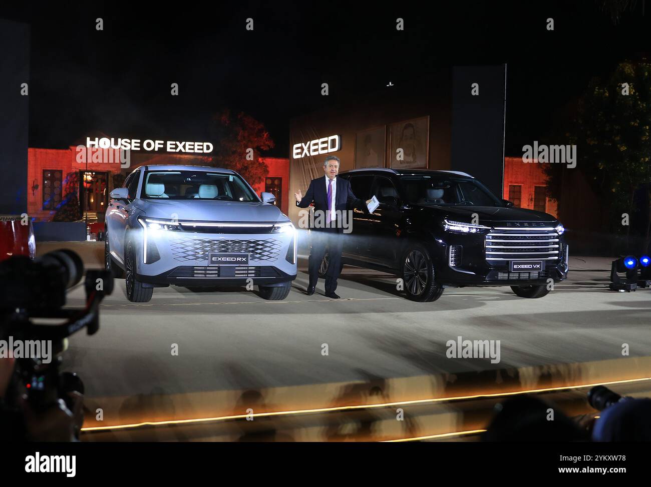 Great Cairo, Egypt. 18th Nov, 2024. A man introduces two Exeed SUV ...