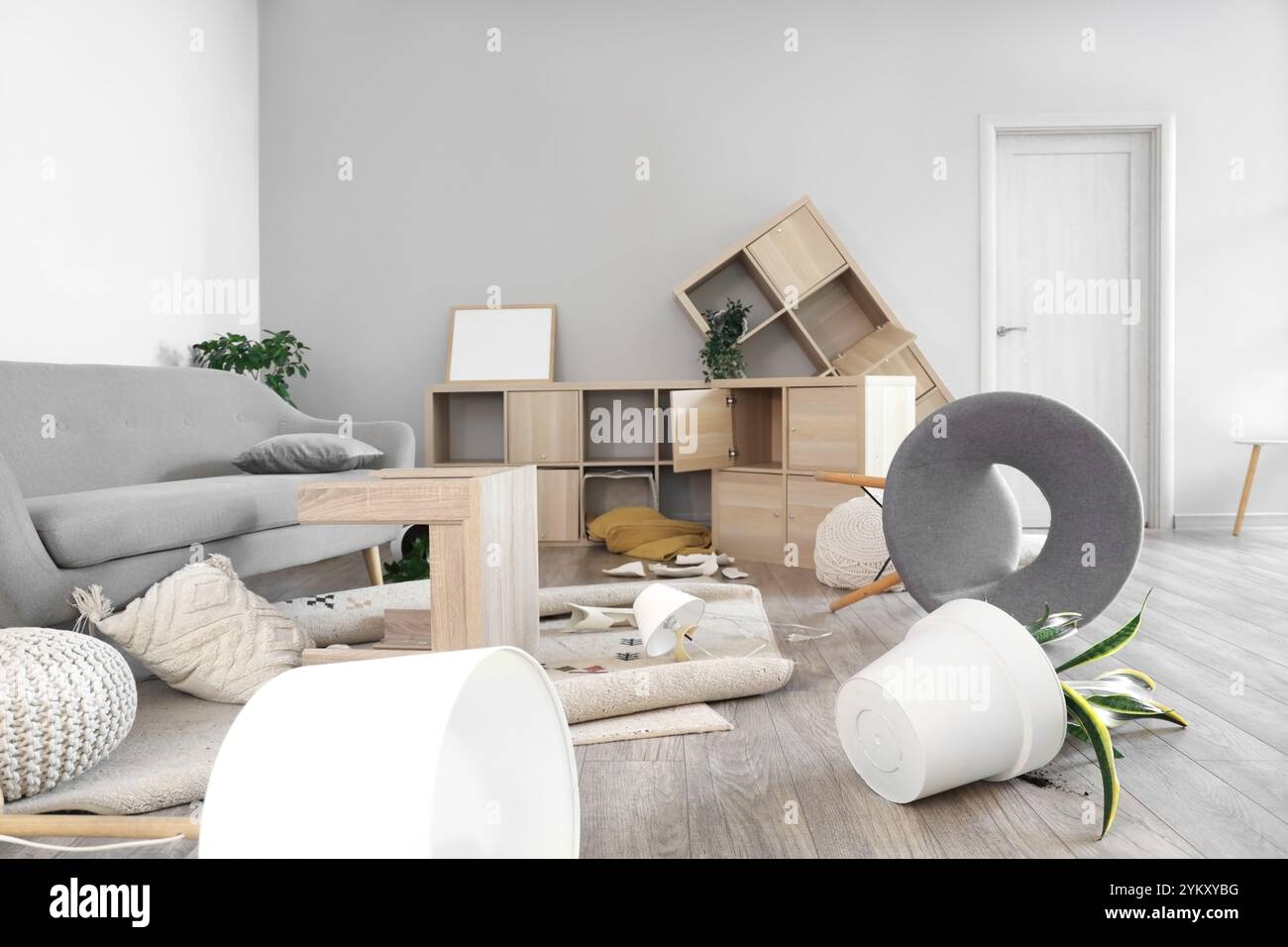 Interior of messy living room with overturned furniture after ...