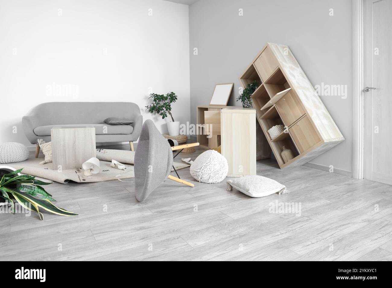 Interior of messy living room with overturned furniture after ...
