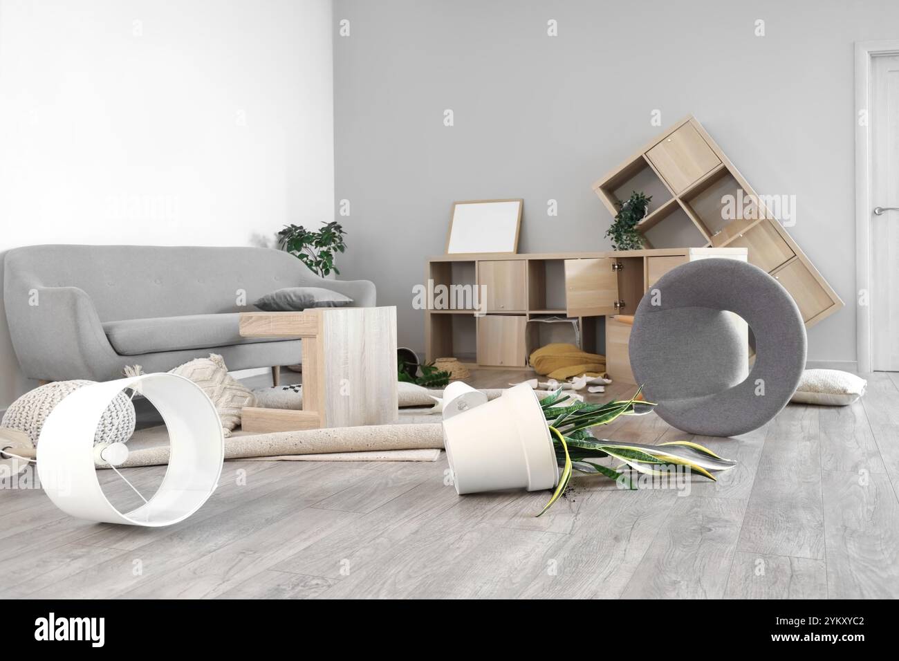 Interior of messy living room with overturned furniture after ...