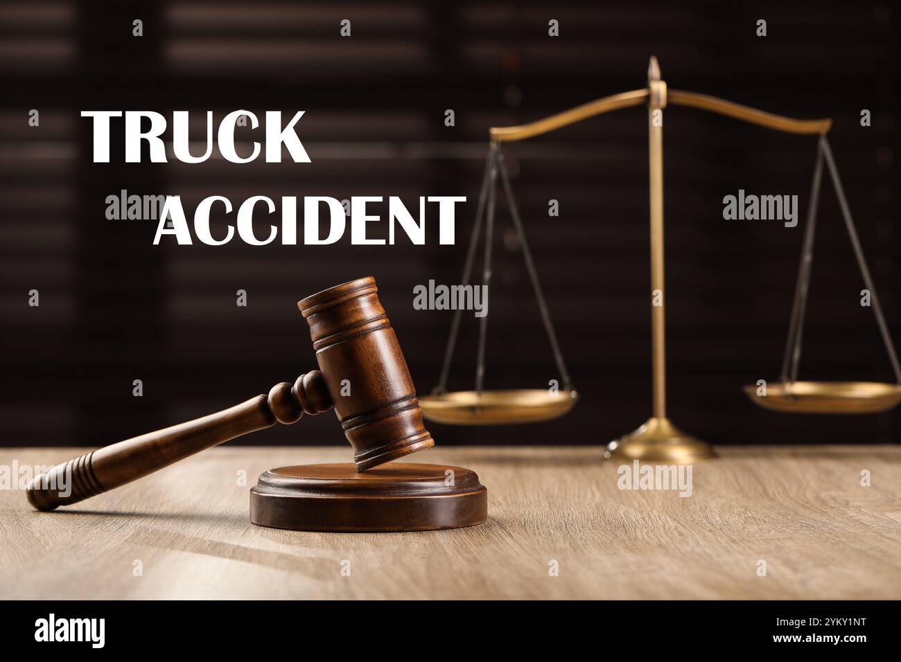 Truck accident law. Wooden judge's gavel and scales of justice on table ...