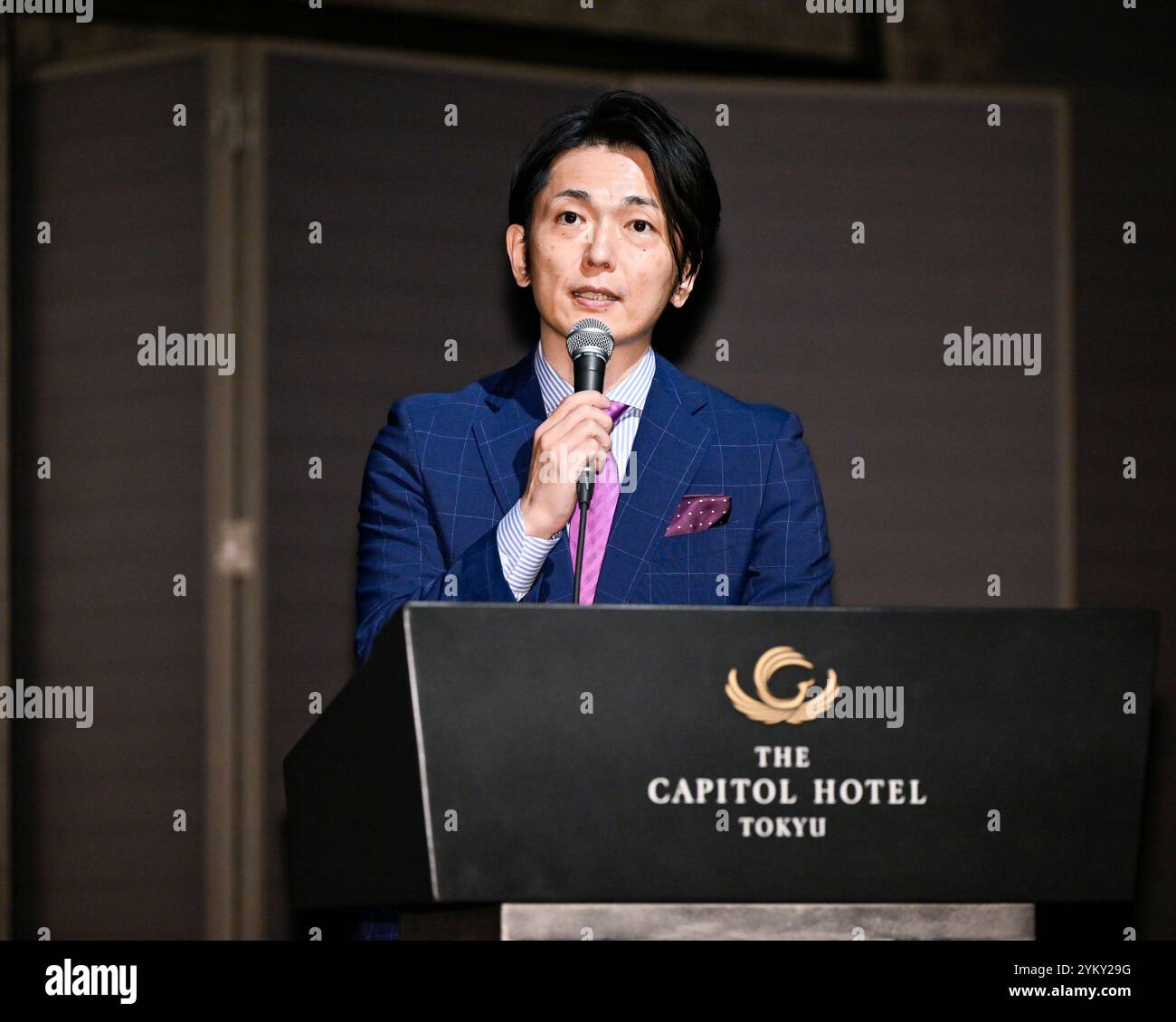 Announcer Masaru Akahira acts as master of ceremonies during a press ...