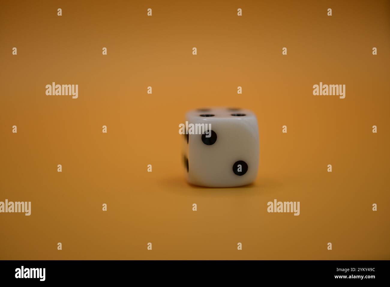 Dice against orange background hi-res stock photography and images - Alamy