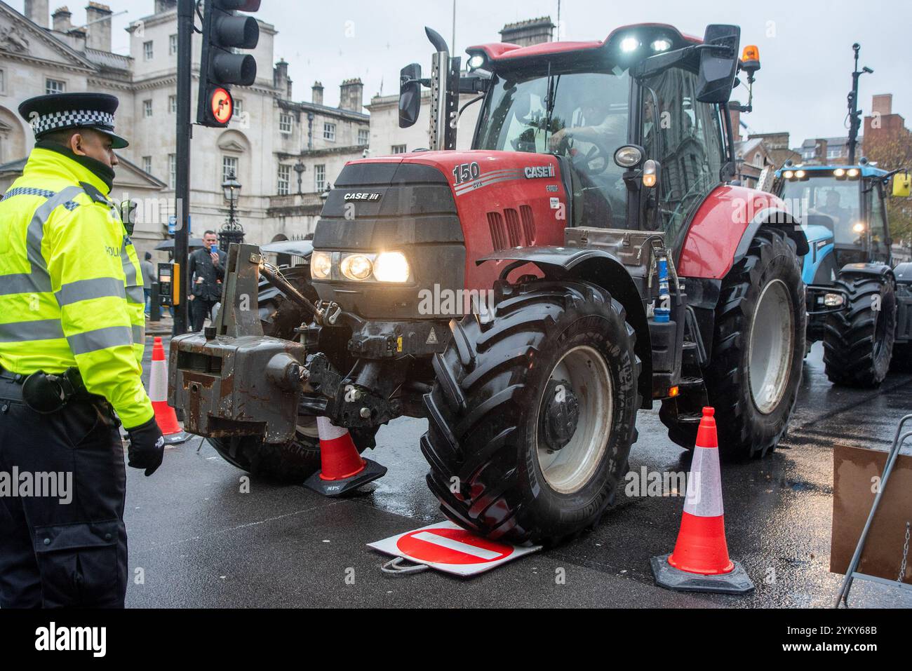 London, UK. 19th Nov, 2024. A tractor drives through over a 'NO Entry ...