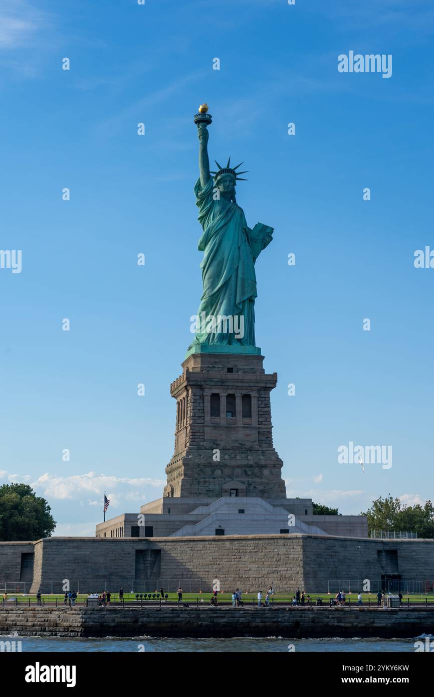 Liberty Island and Statue of Liberty view from the water. New York City ...