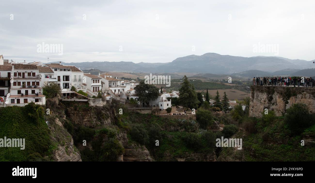 Cliff side view of Ronda in Spain, with white buildings built onto of ...