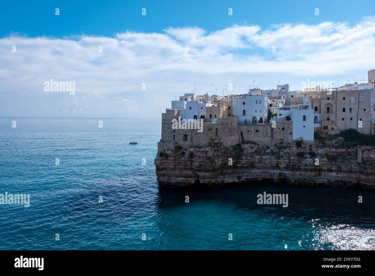 Polignano a Mare Waves gently lap against the rugged cliffs of Puglia ...