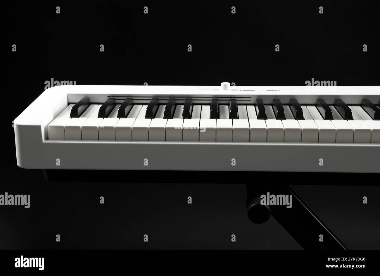 Synthesizer on black background, closeup. Electronic musical instrument ...