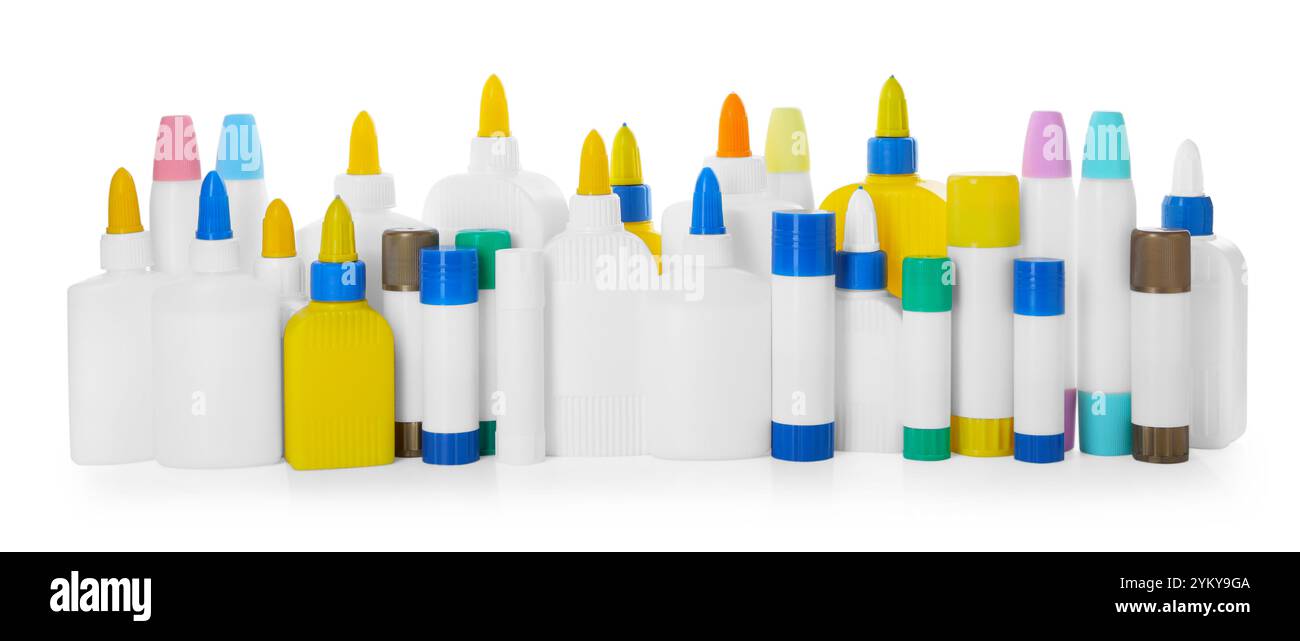 Bottles and sticks of glue on white background Stock Photo - Alamy