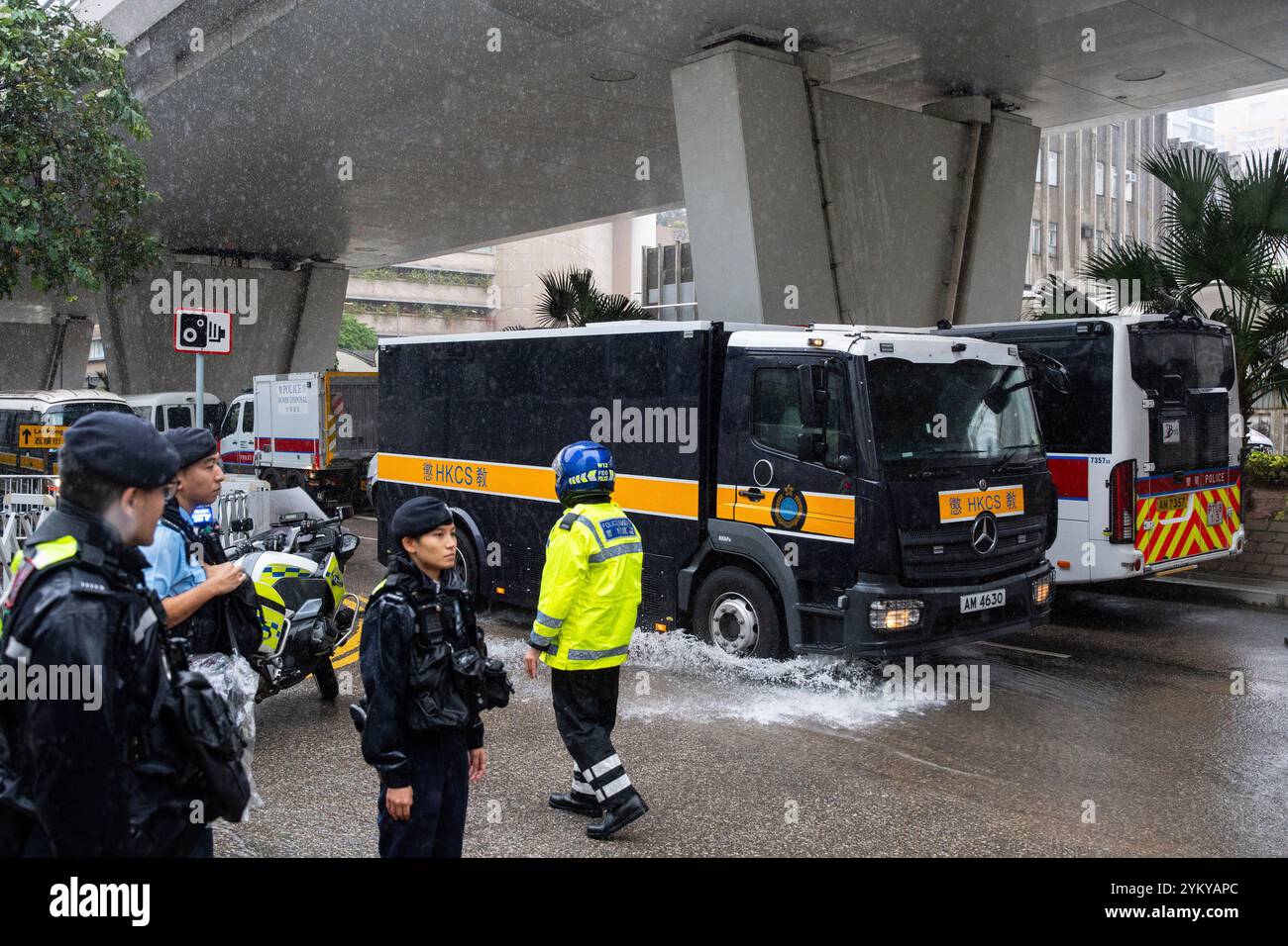 A Correctional Services Department vehicle arrives at the West Kowloon ...