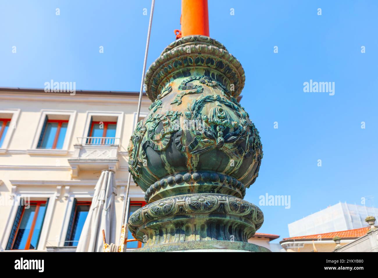 Decorative base of a flagpole or column. Base is intricately designed ...