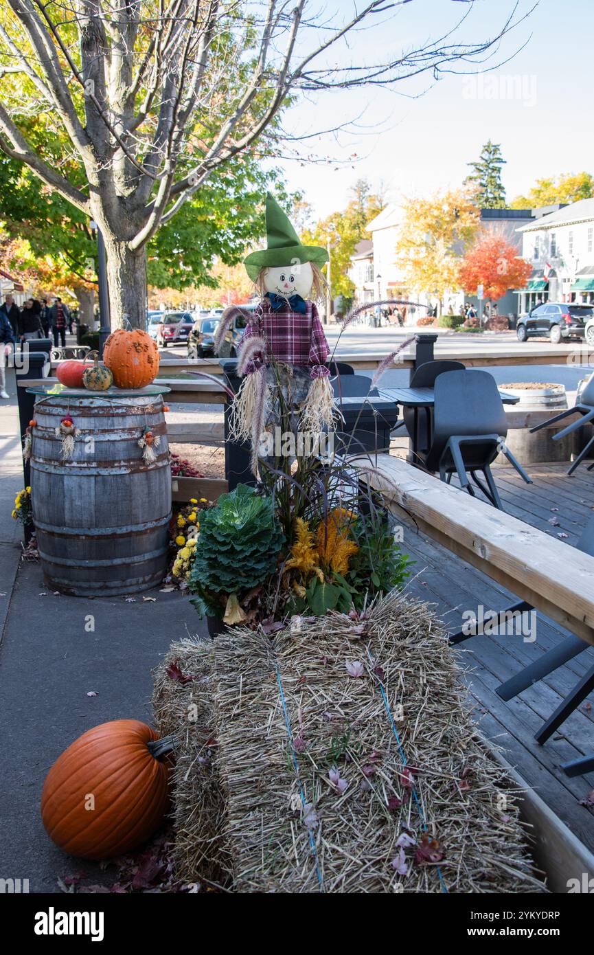 Scarecrow boy pushing a wheelbarrow on Queen Street in downtown Niagara ...