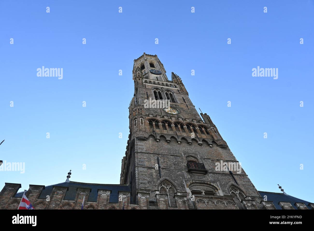 Belfry of Bruges (Belfort van Brugge) with a blue sky – Bruges, Belgium ...