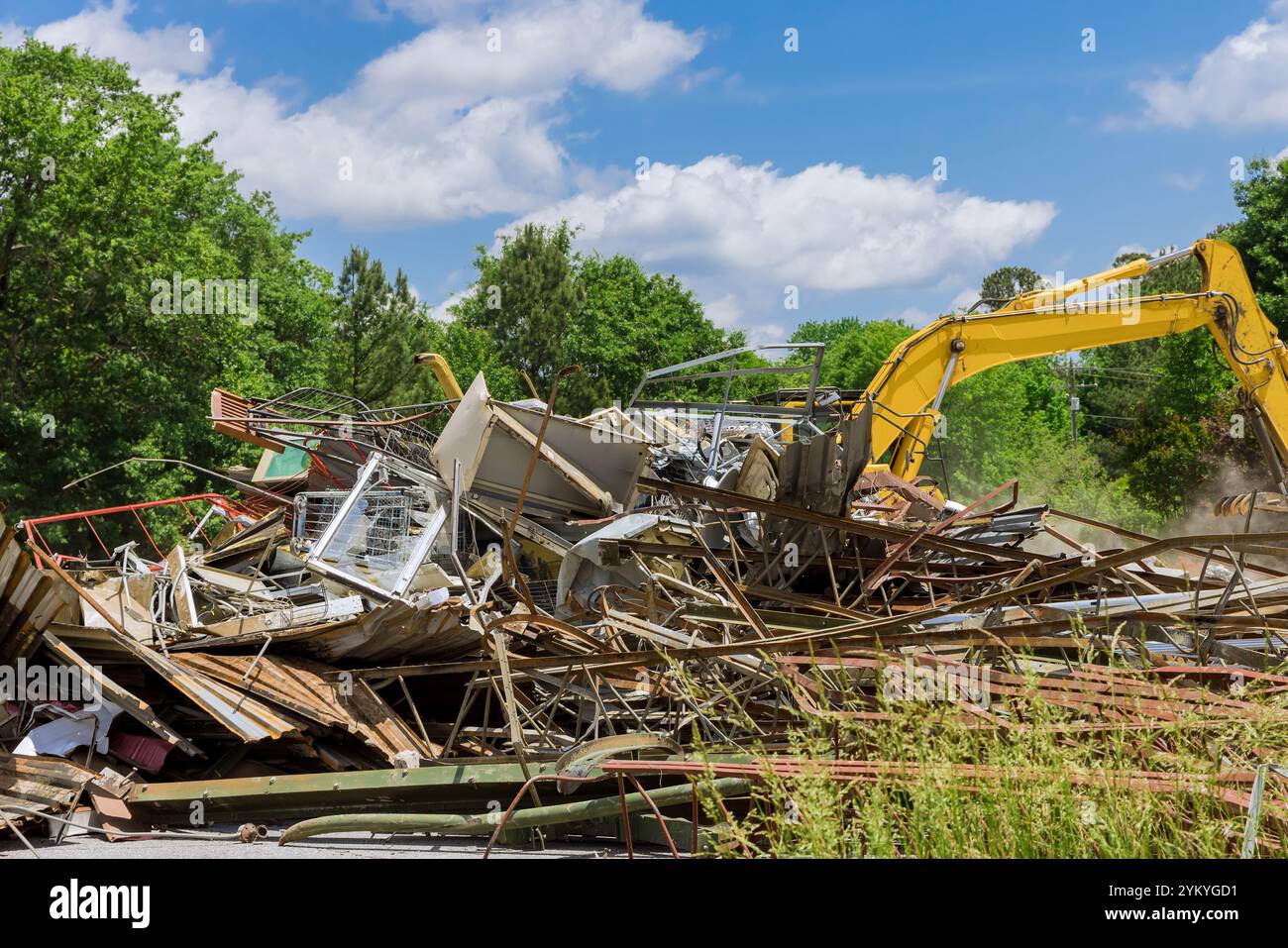 Heavy machinery is actively involved in construction demolishing ...
