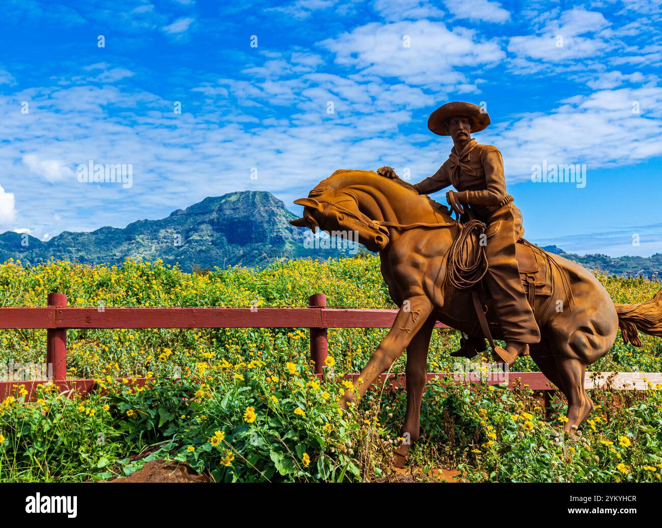Statue of Paniolo Cowboy on His Horse With The Haupu Mountain Range in ...