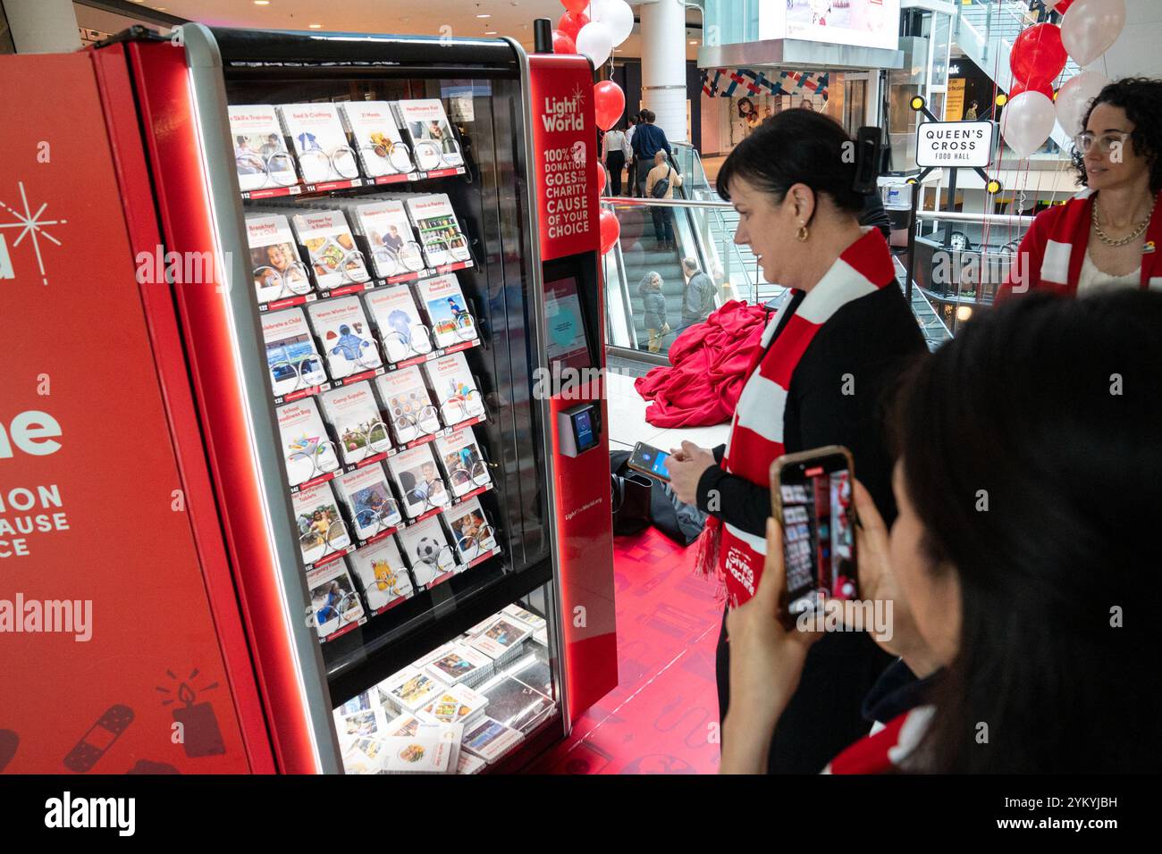 Toronto, Canada. 19th Nov, 2024. Rebecca Davies makes a donation at The Light The World Giving ...