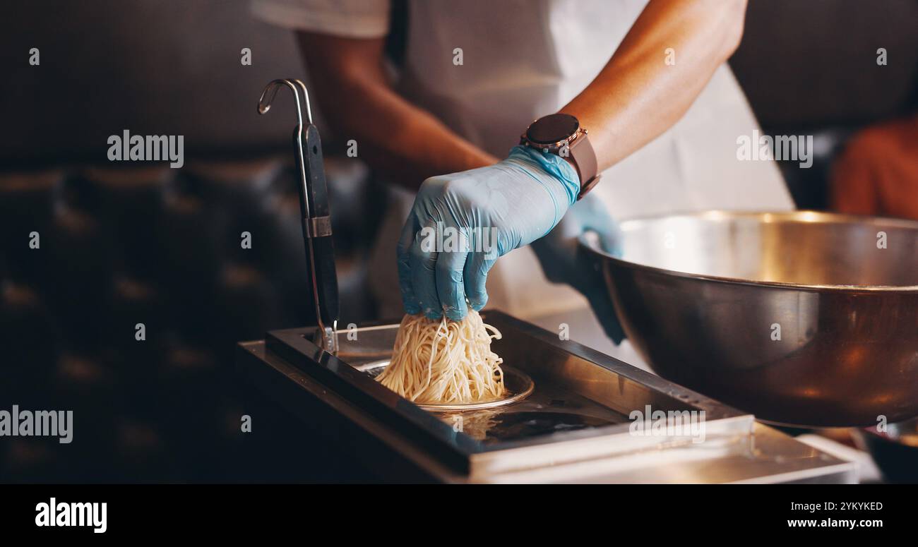 Japan, restaurant and hands boiling noodles for traditional cuisine ...