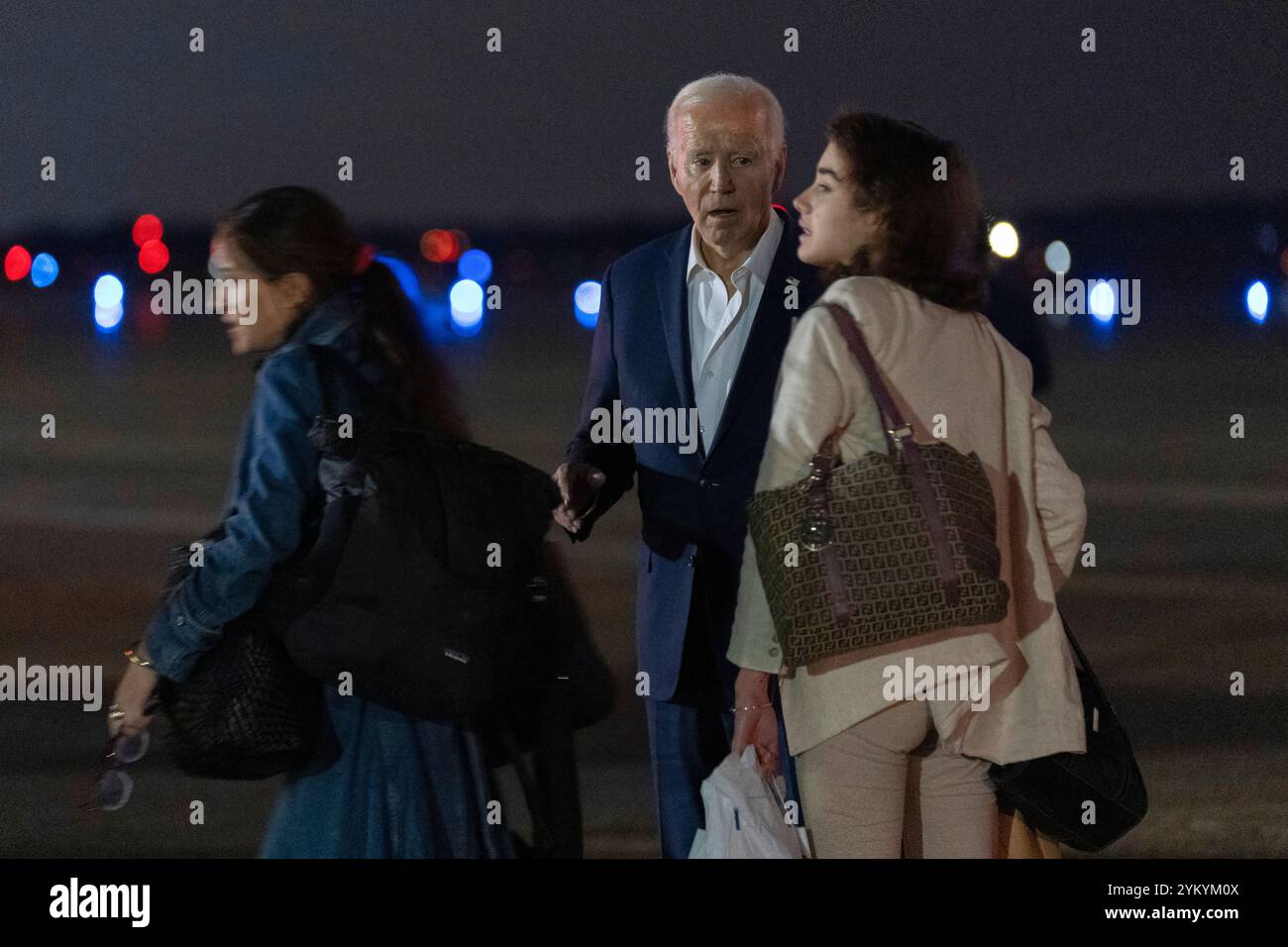 President Joe Biden, center, arrives on Air Force One late Tuesday, Nov ...
