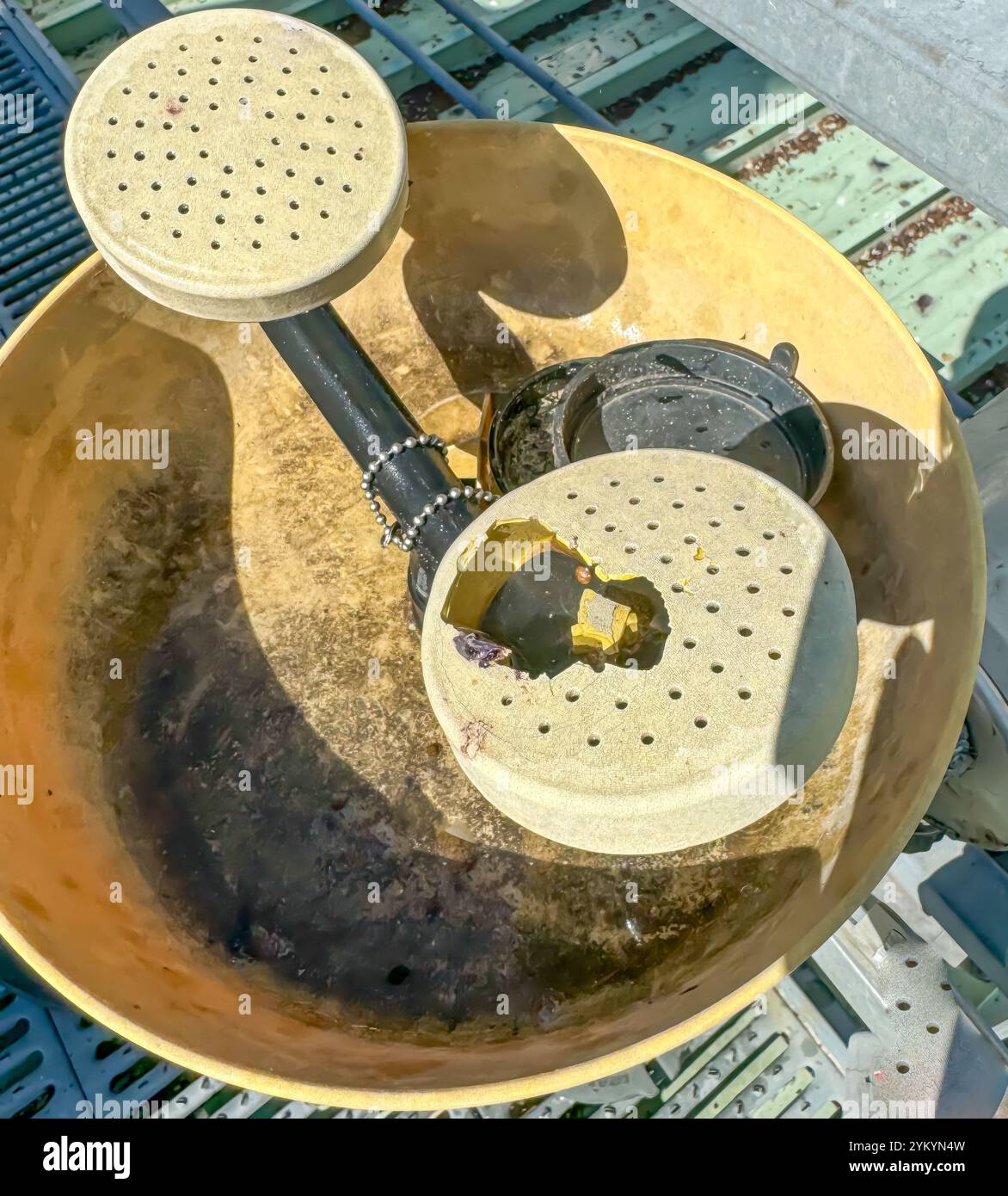 damaged eyewash safety station with missing covers in an industrial ...