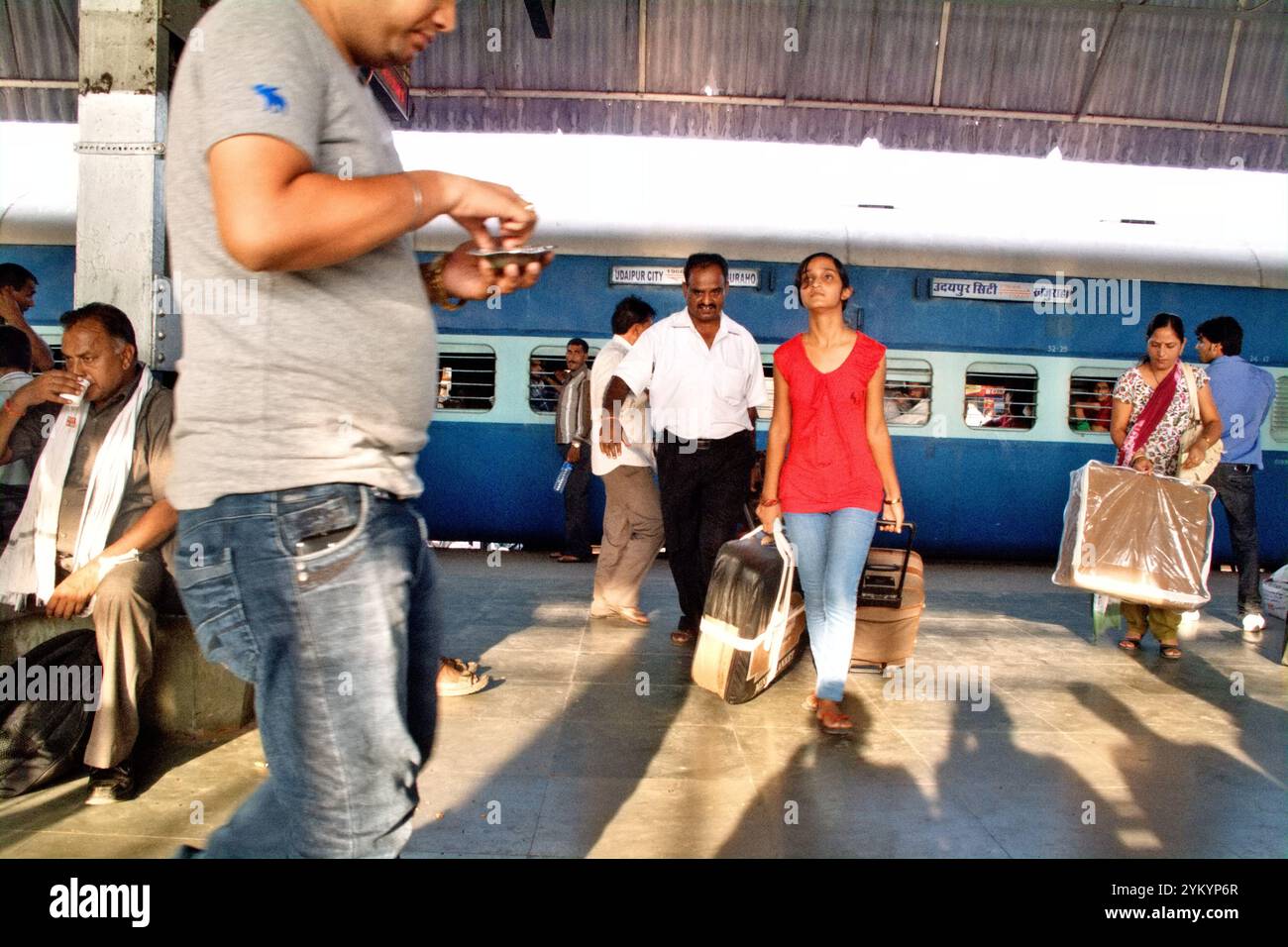 Train passengers waiting for departure time at the passenger platform ...