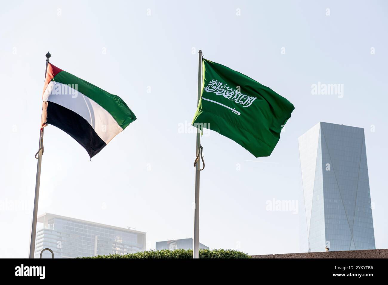 flags of Saudi Arabia and the United Arab Emirates against the ...