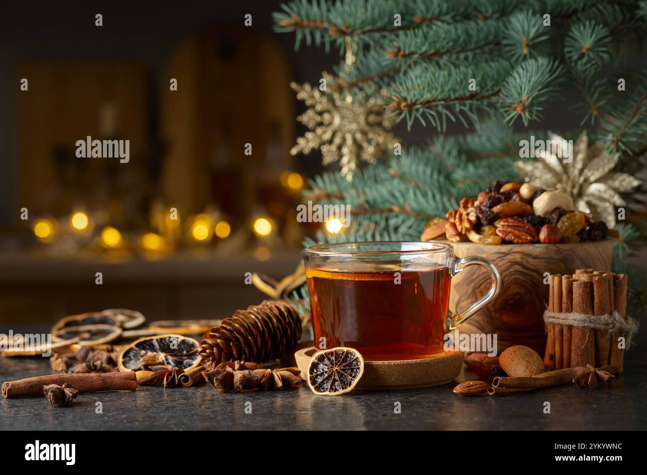 Tea with spices and dry fruits on a kitchen table. Christmas still-life ...