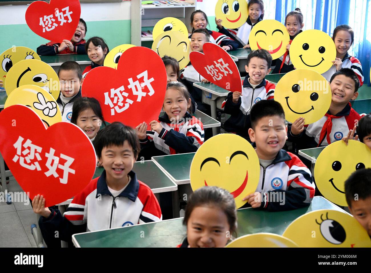 Students display smiley face cards and greeting cards in Handan, North ...