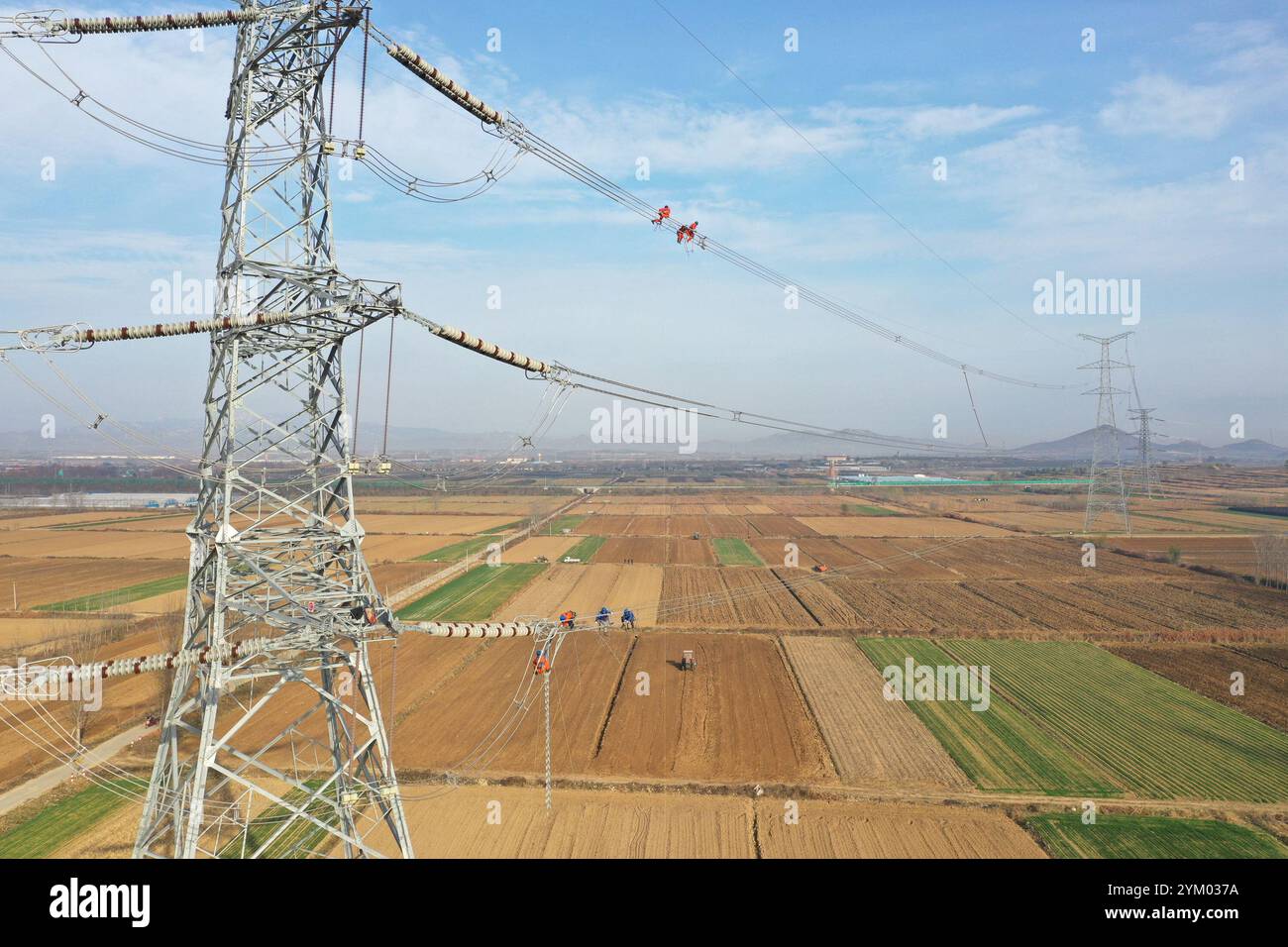 WEIHAI, CHINA - NOVEMBER 19, 2024 - Power inspection workers use ...