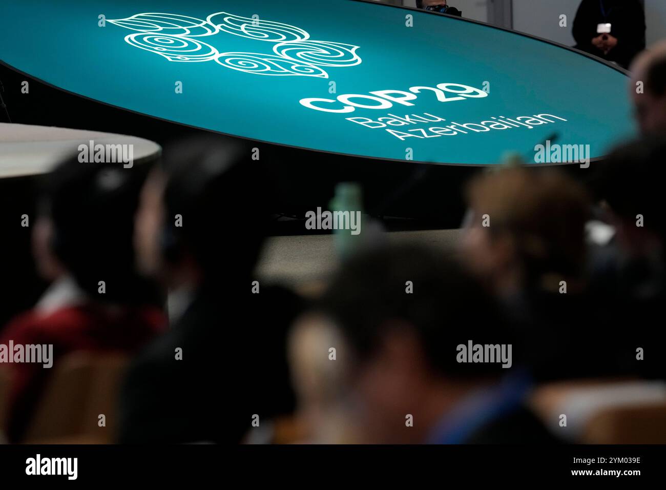 A logo for the COP29 U.N. Climate Summit is visible during a session on ...