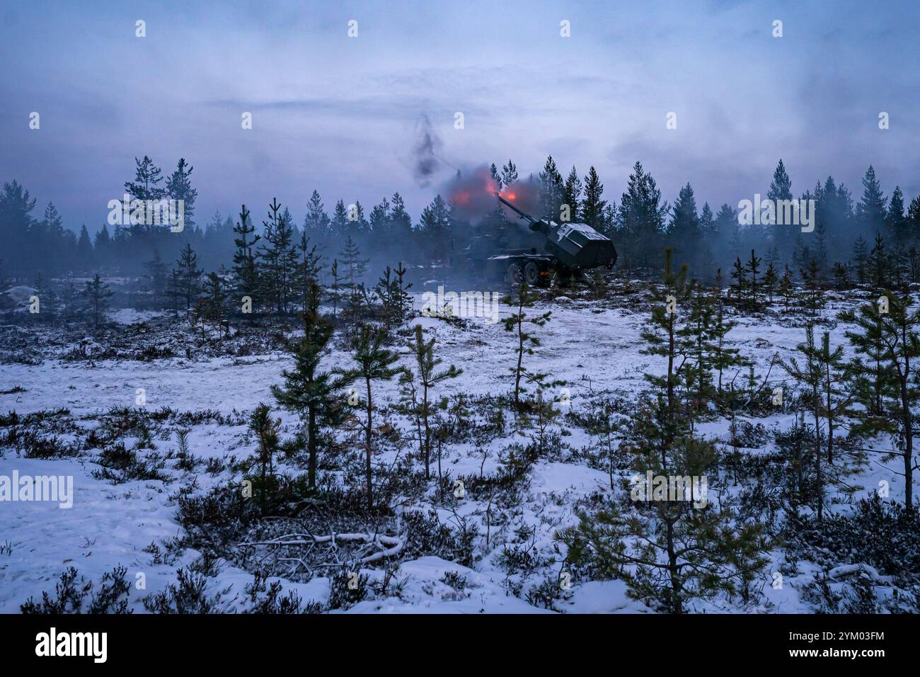 A muzzle flash is seen as the British Army's new Archer Mobile Howitzer ...