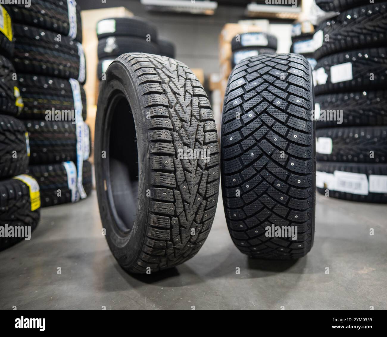 Comparison of old and new studded car tires Stock Photo - Alamy