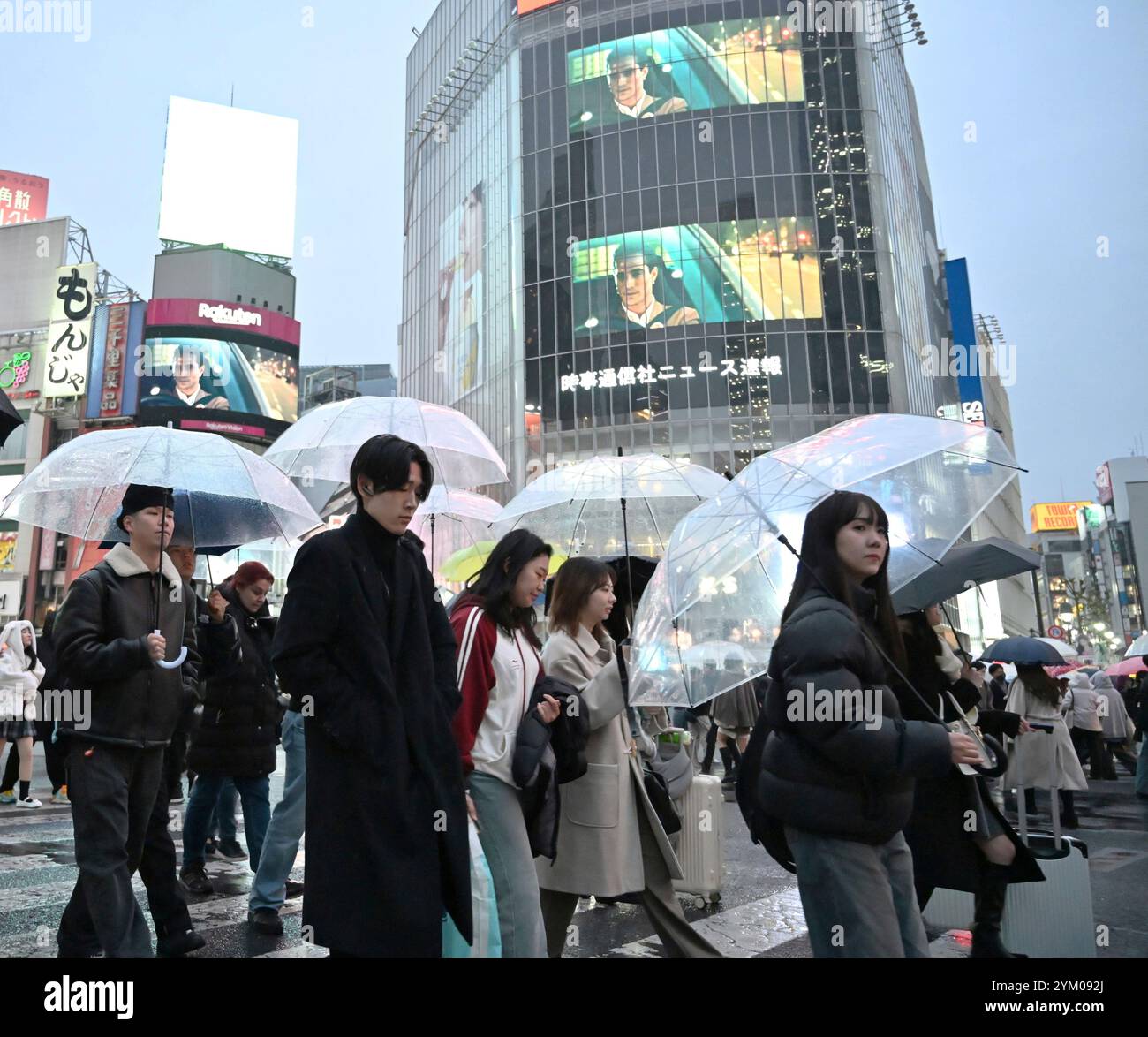 People walk at Shibuya Crossing amid the temperature is low in Tokyo on ...