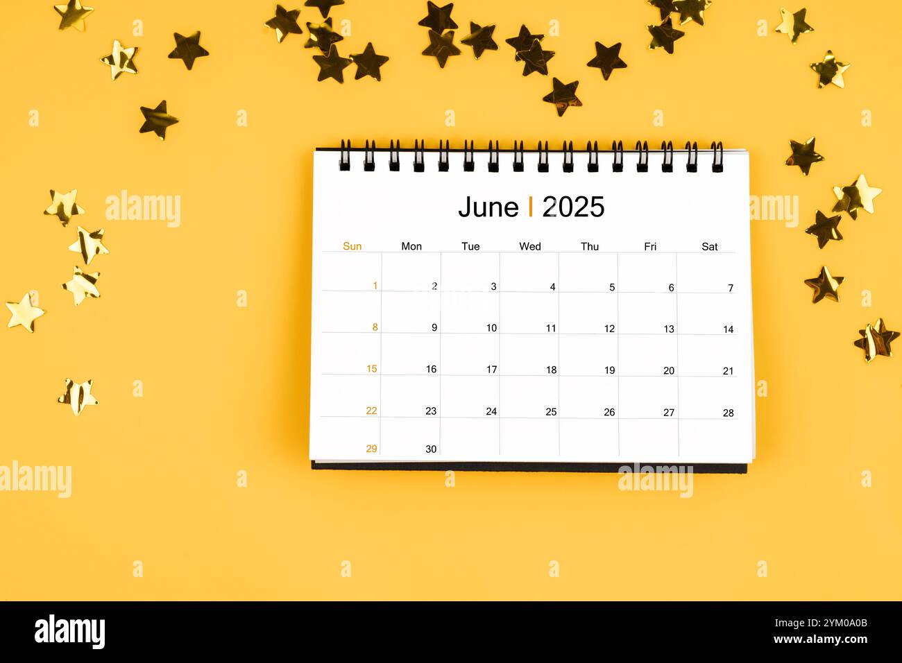 June 2025 calendar and scattered sparkling yellow confetti stars on a ...