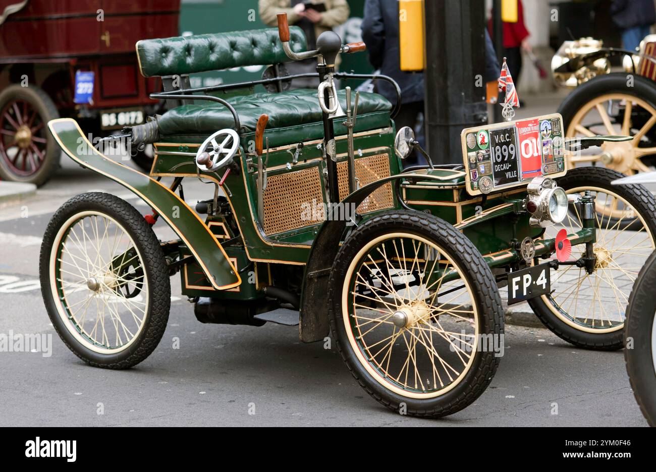 Three-quarters front view of a 1899, Decauville Voiturette, parked near ...