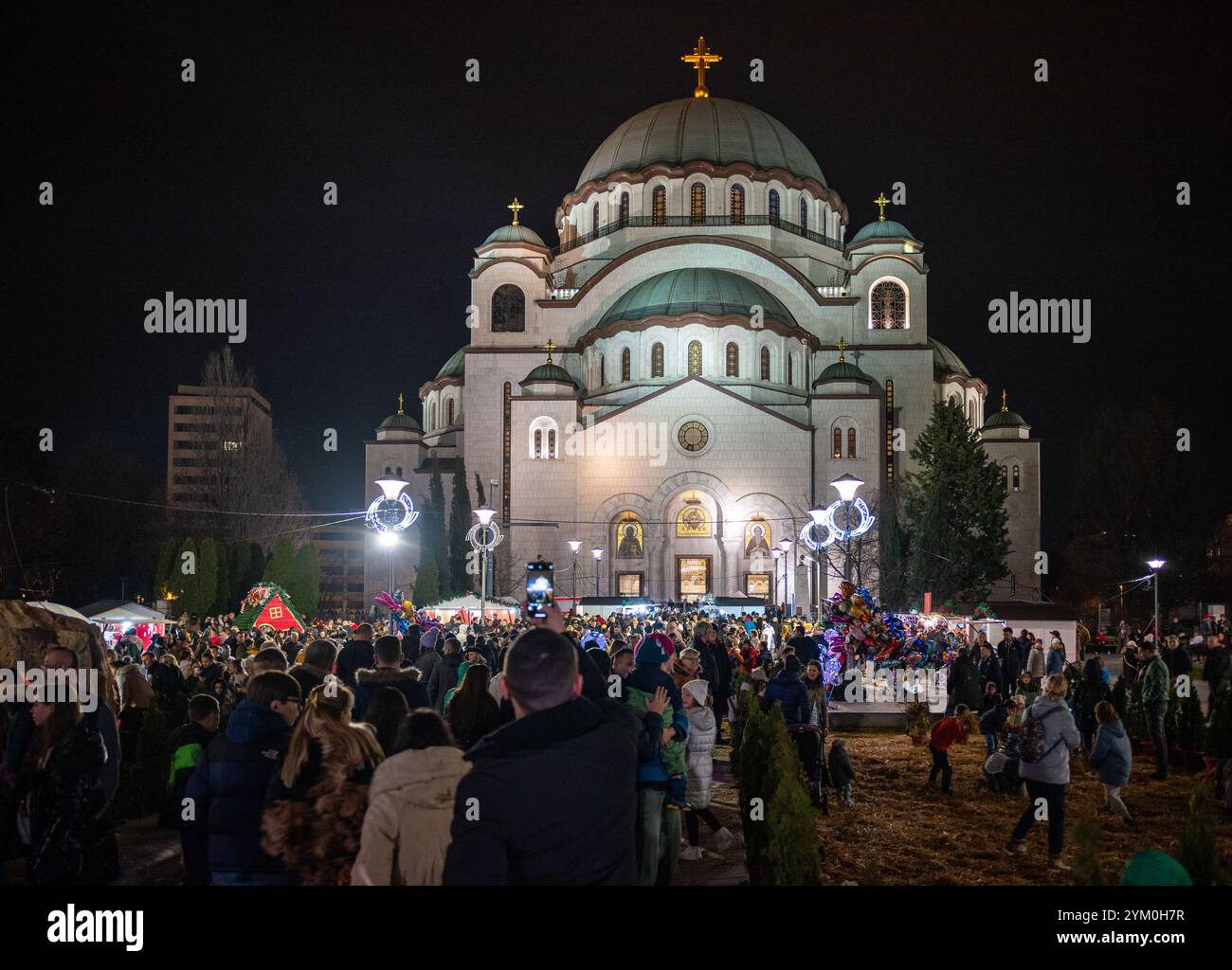 People watch a ceremonial burning of Badnjak - dried oak branches on ...