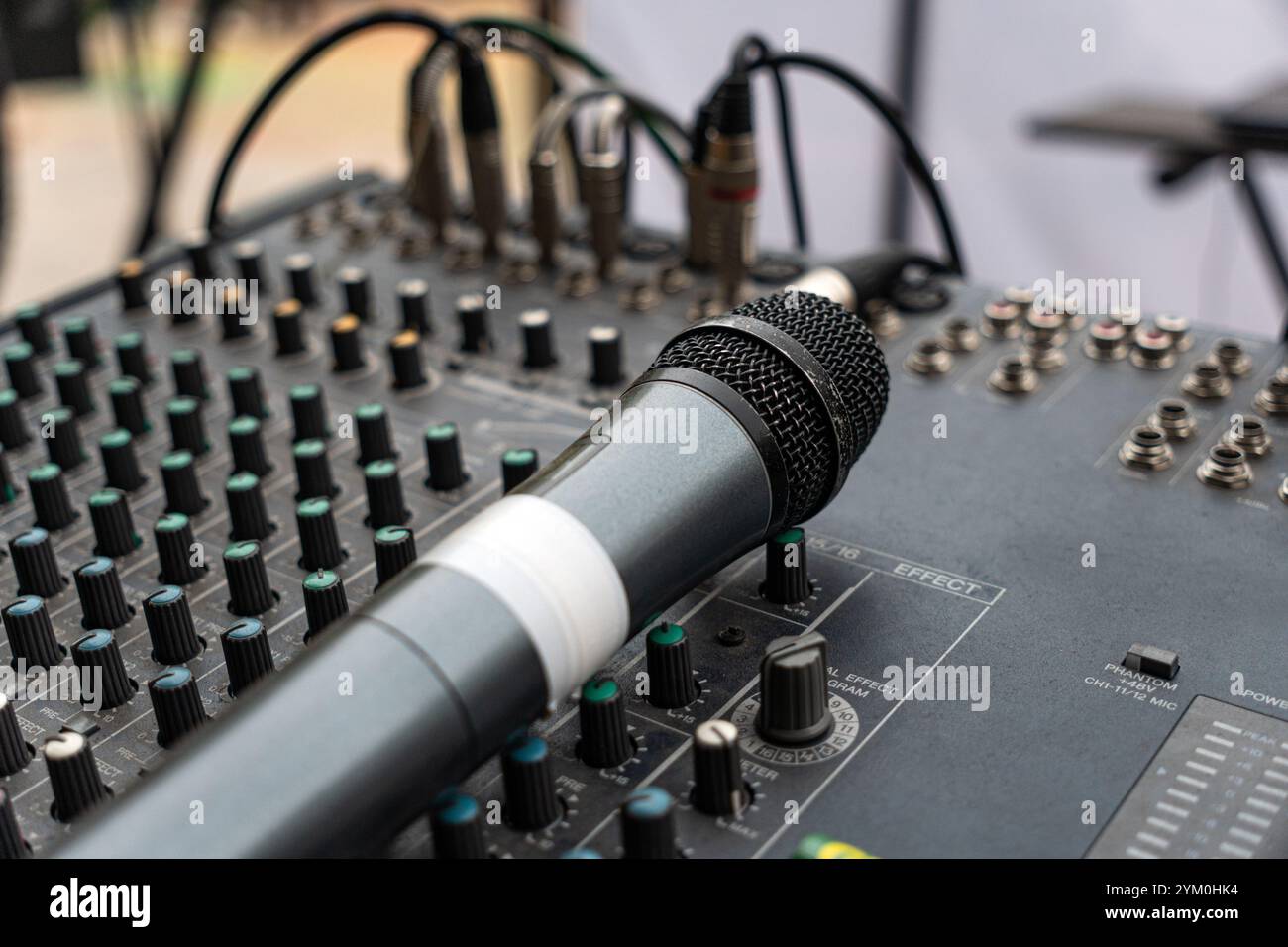 microphone on a mixer. the concert microphone is on the mixing console ...