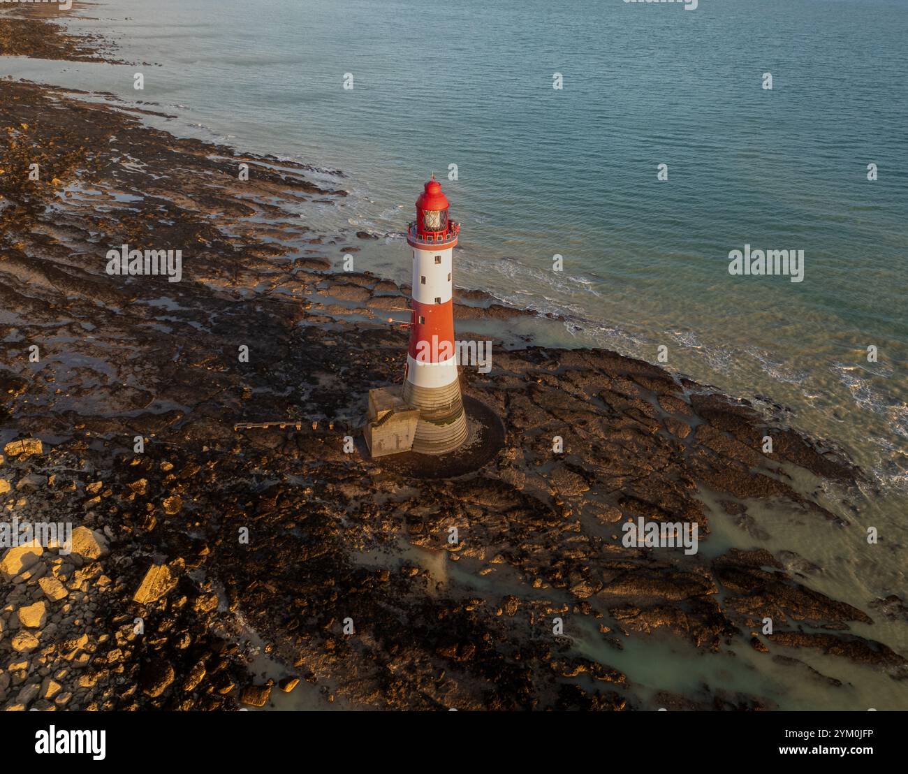 Beachy Head Lighthouse in the English Channel below the cliffs of ...