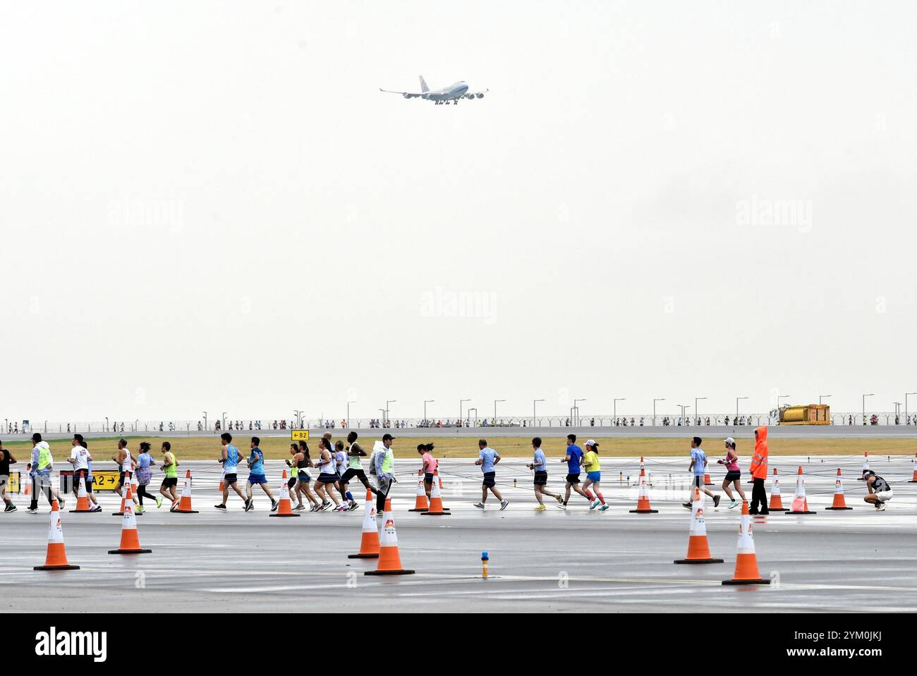 People participate in a running event to celebrate the upcoming launch ...