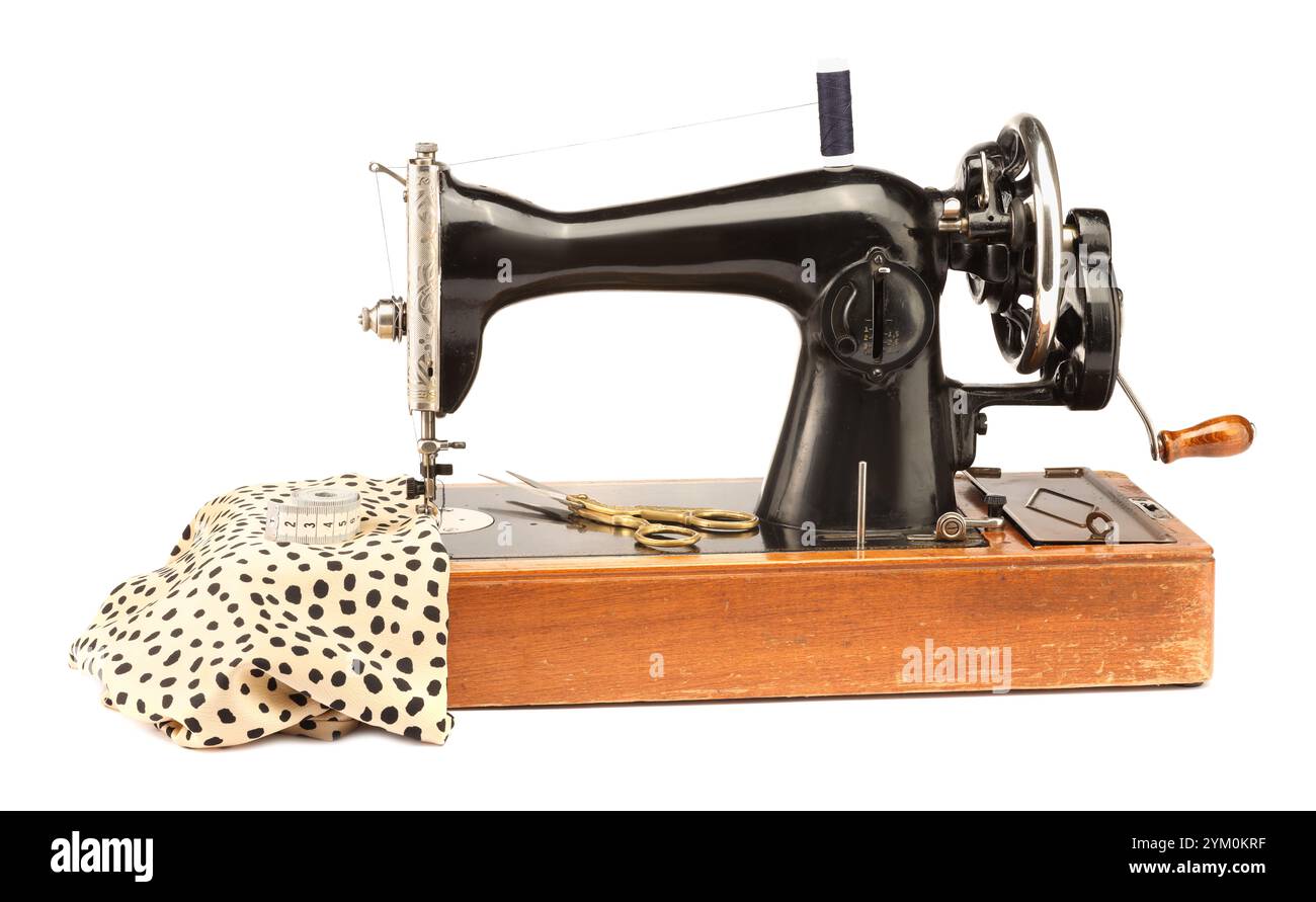 Sewing machine with fabric, measuring tape, scissors and spool of ...
